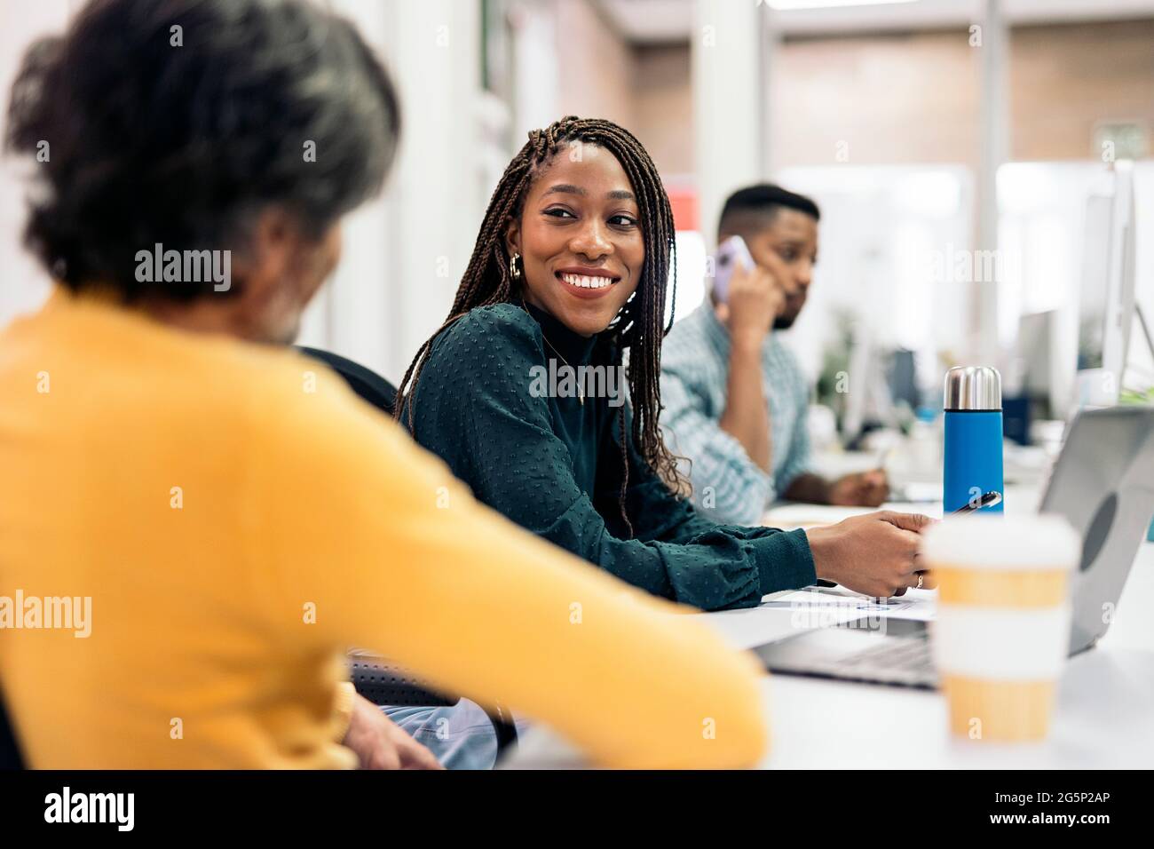 Happy african office worker hi-res stock photography and images - Alamy
