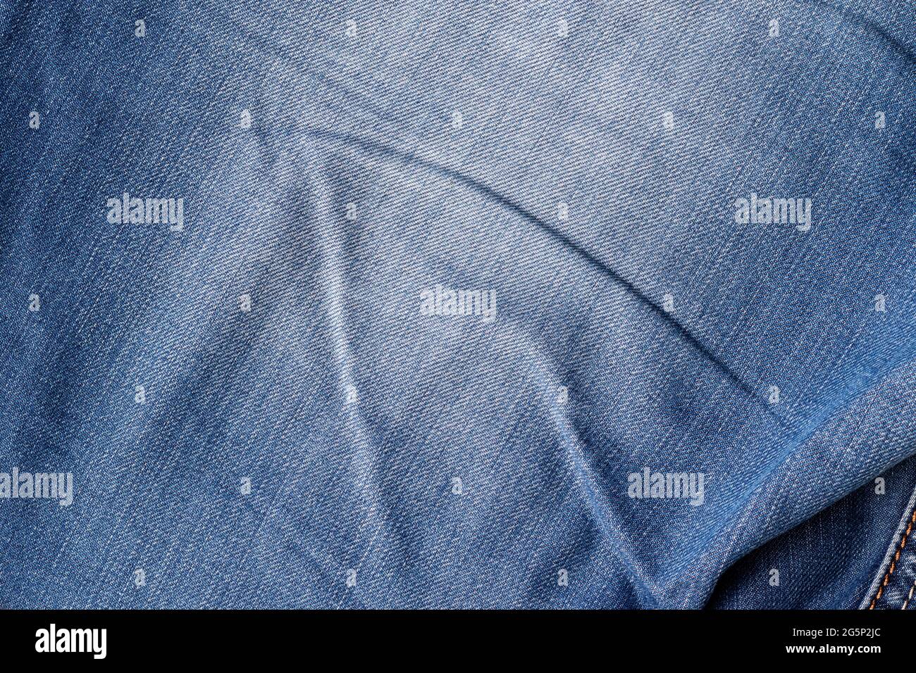 Blue jeans fabric texture. Distressed denim with seam background Stock ...