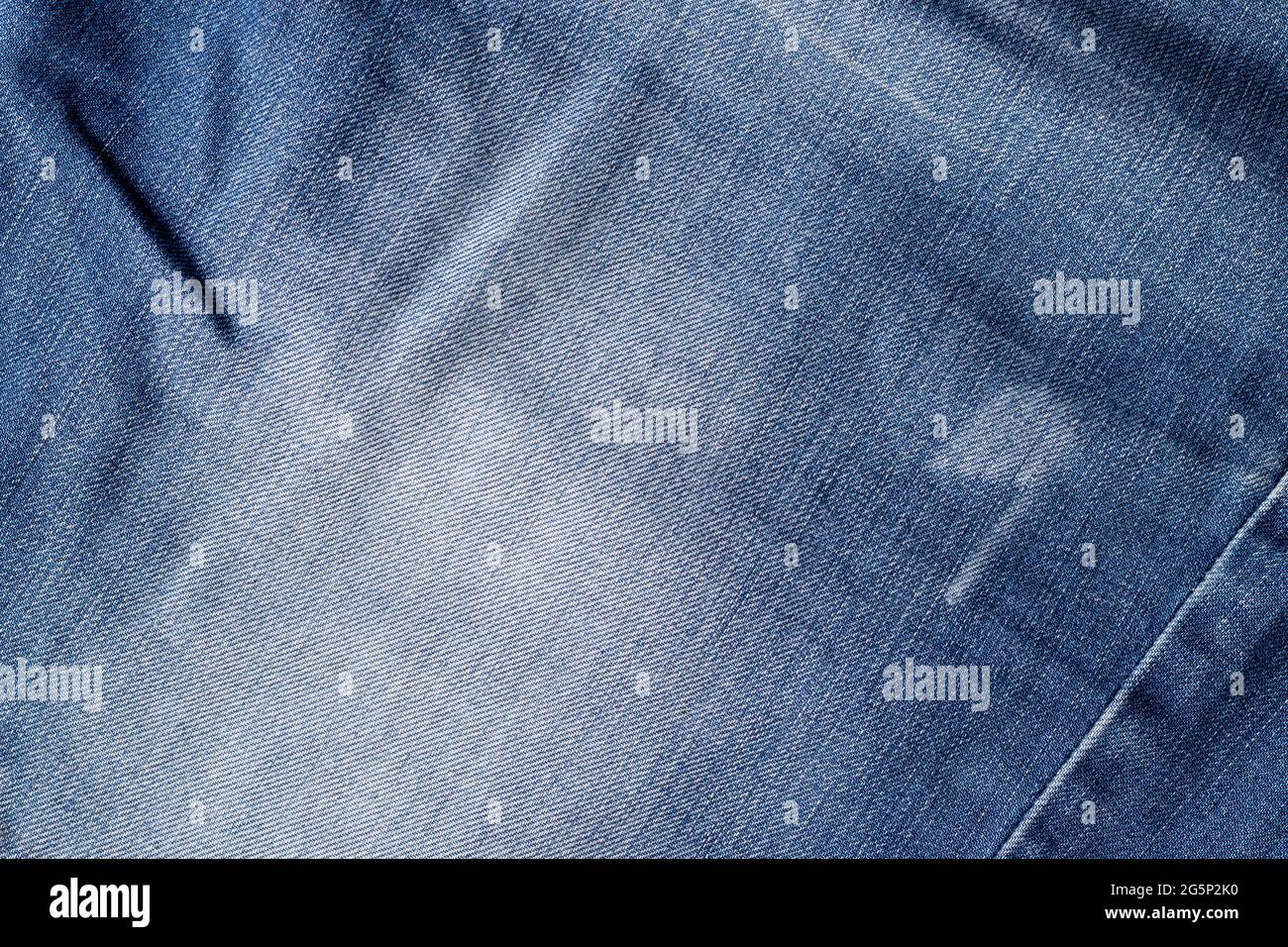 Blue jeans fabric texture. Distressed denim with seam background Stock ...