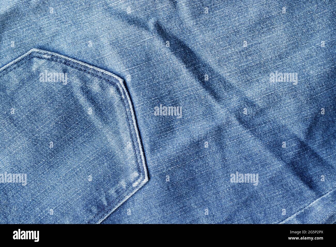 Blue jeans fabric texture. Distressed denim with back pocket background ...