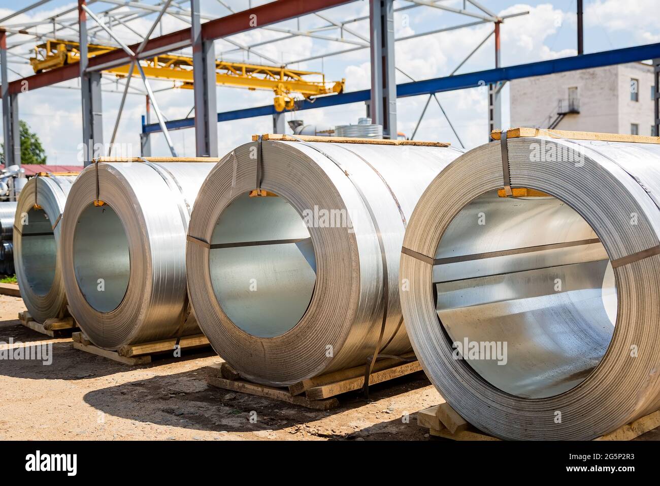 Stainless steel rolls. Rolls of steel sheet in the warehouse. A roll of ...