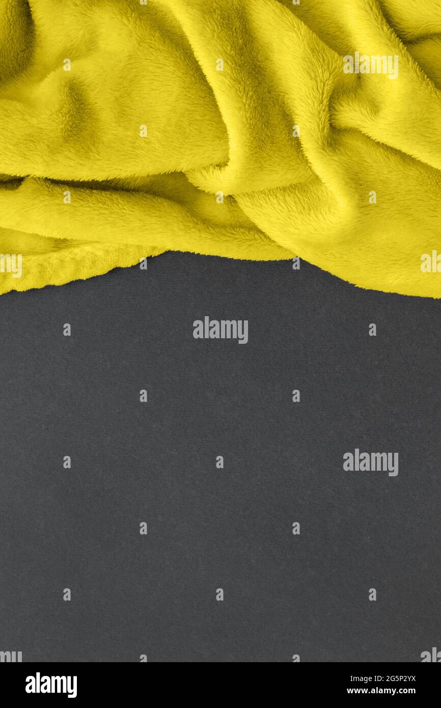 Yellow illuminating fluffy fabric and paper gray texture. Crumpled ...