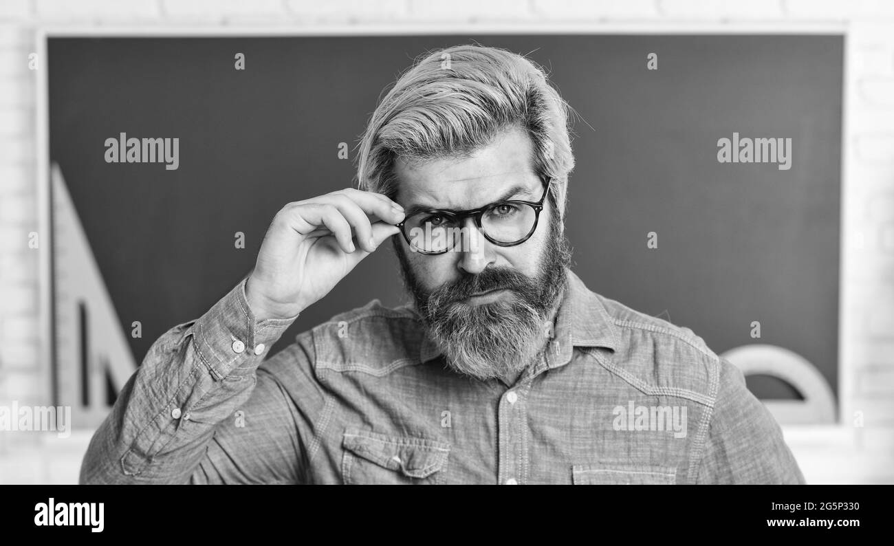 elementary mathematics. strict teacher in glasses. teacher check ...