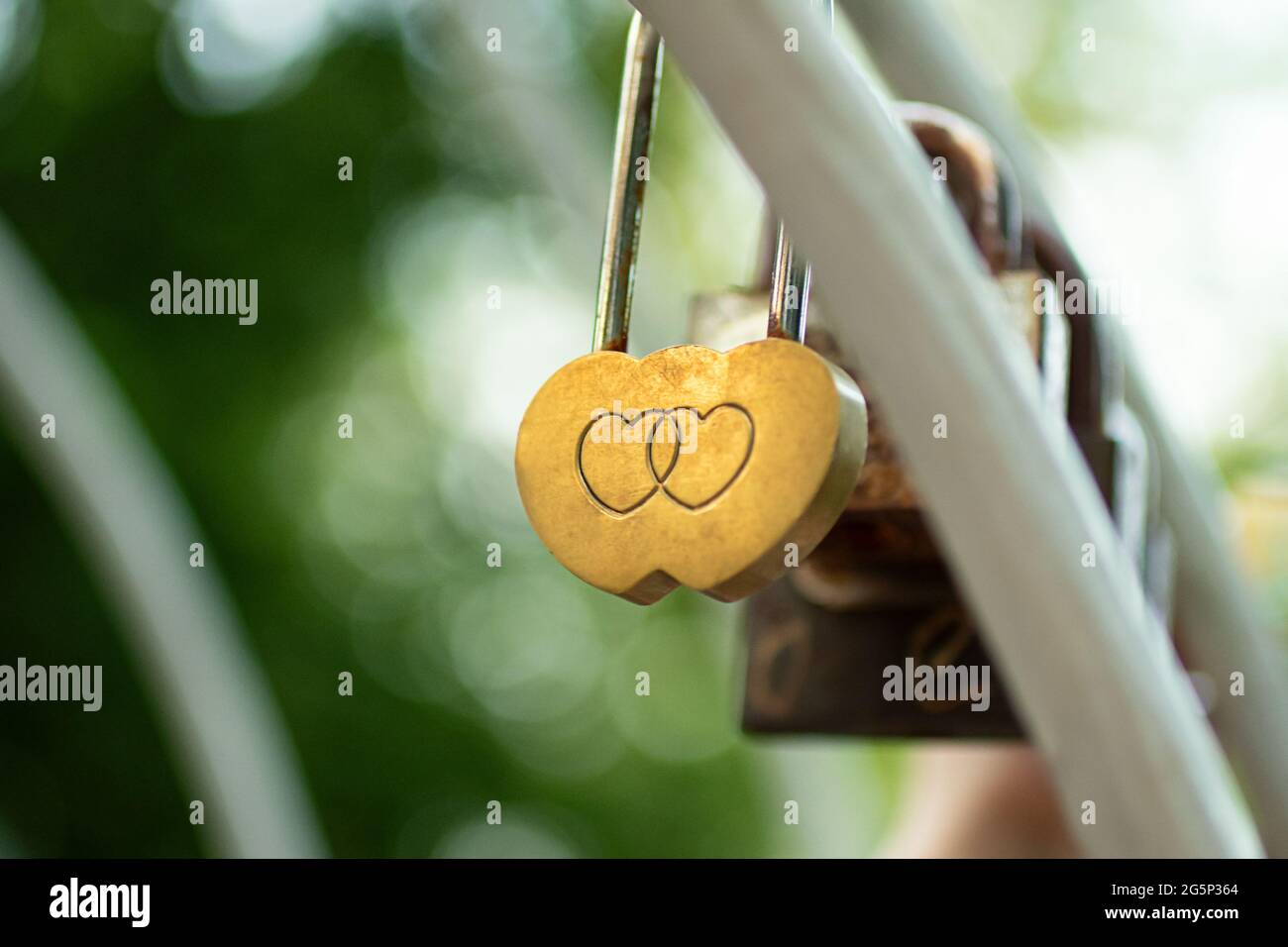 Golden wedding lock with two hearts on it.Symbol of love Stock Photo ...