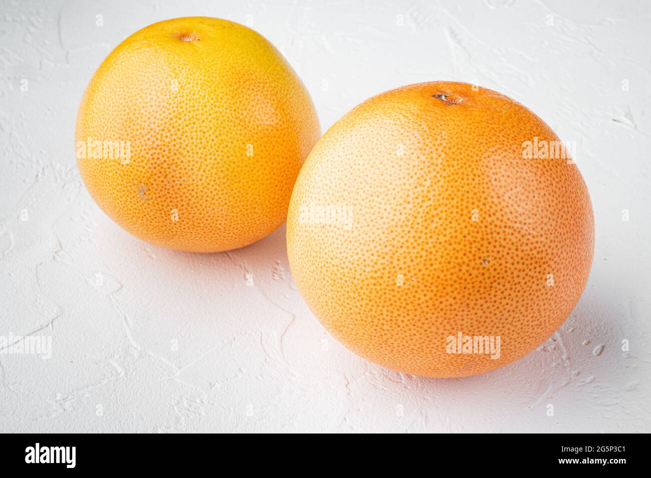 Whole Grapefruit set, on white stone table background Stock Photo - Alamy