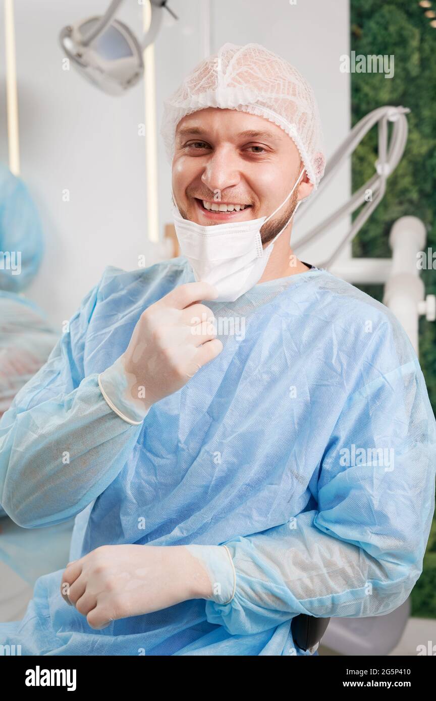 Putting off mask hi-res stock photography and images - Alamy