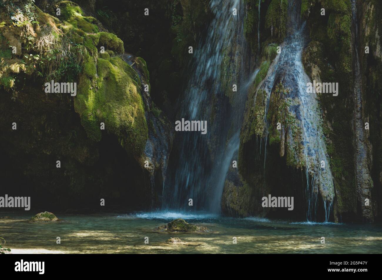 The tufa waterfall near Arbois. Crystal clear waterfall, powerful ...