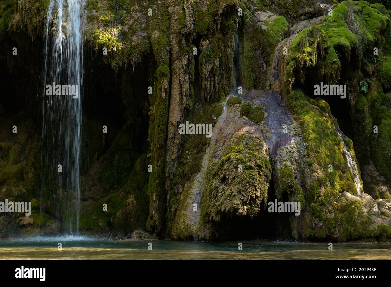 The tufa waterfall near Arbois. Crystal clear waterfall, powerful ...