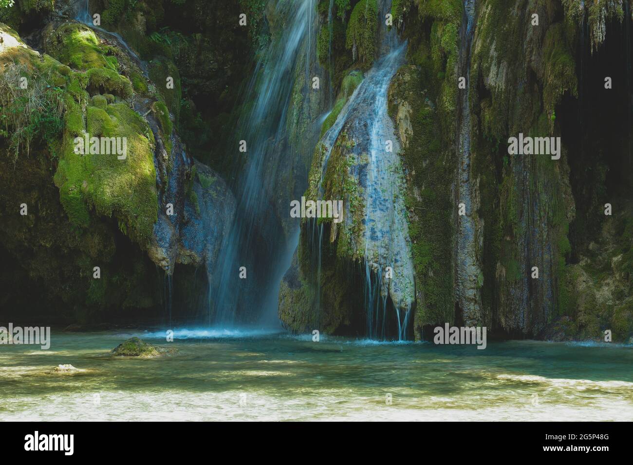 The tufa waterfall near Arbois. Crystal clear waterfall, powerful ...