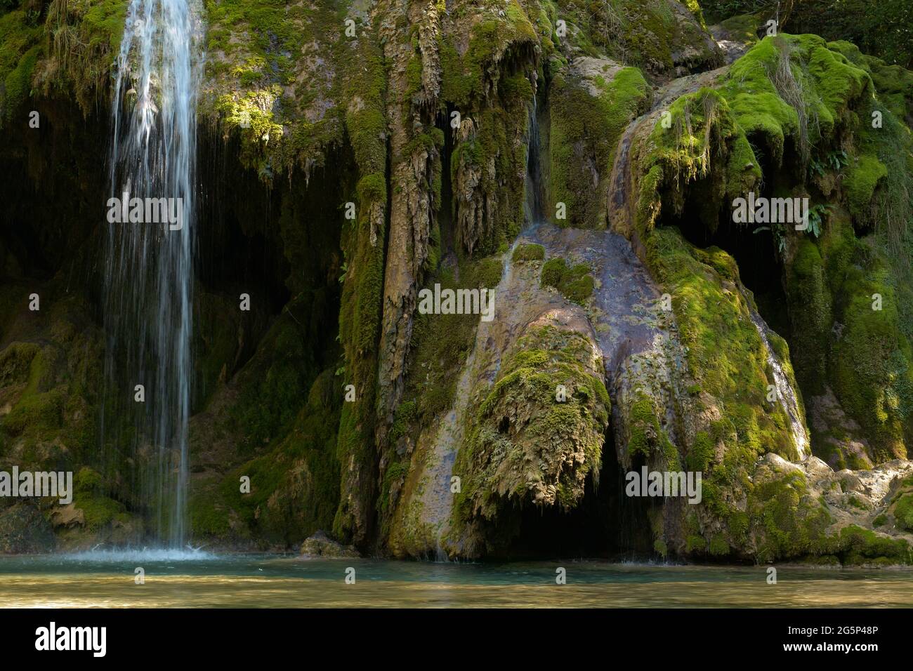The tufa waterfall near Arbois. Crystal clear waterfall, powerful ...