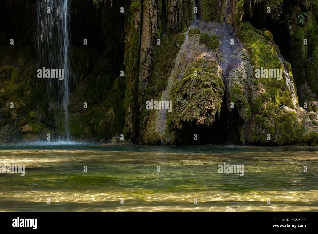 The tufa waterfall near Arbois. Crystal clear waterfall, powerful ...
