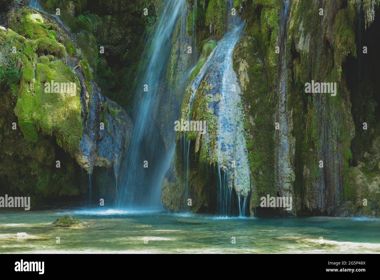 The tufa waterfall near Arbois. Crystal clear waterfall, powerful ...