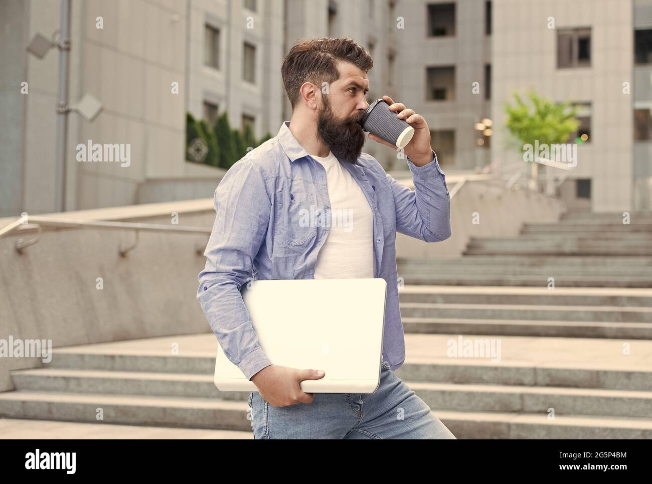 Coffee break. Guy going to work urban background. Man with laptop ...