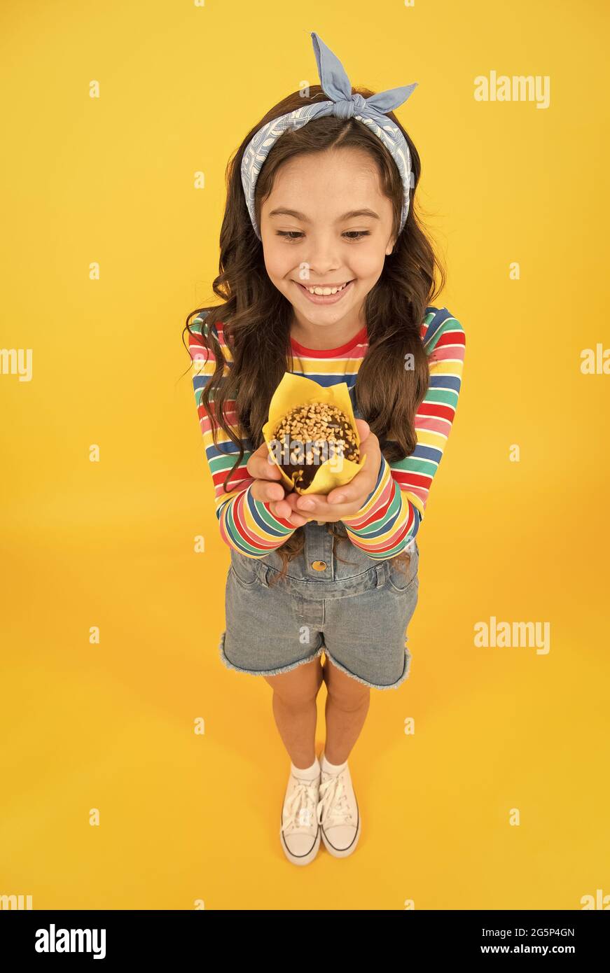Sweet yummy muffin small girl, chocolate snack concept Stock Photo - Alamy