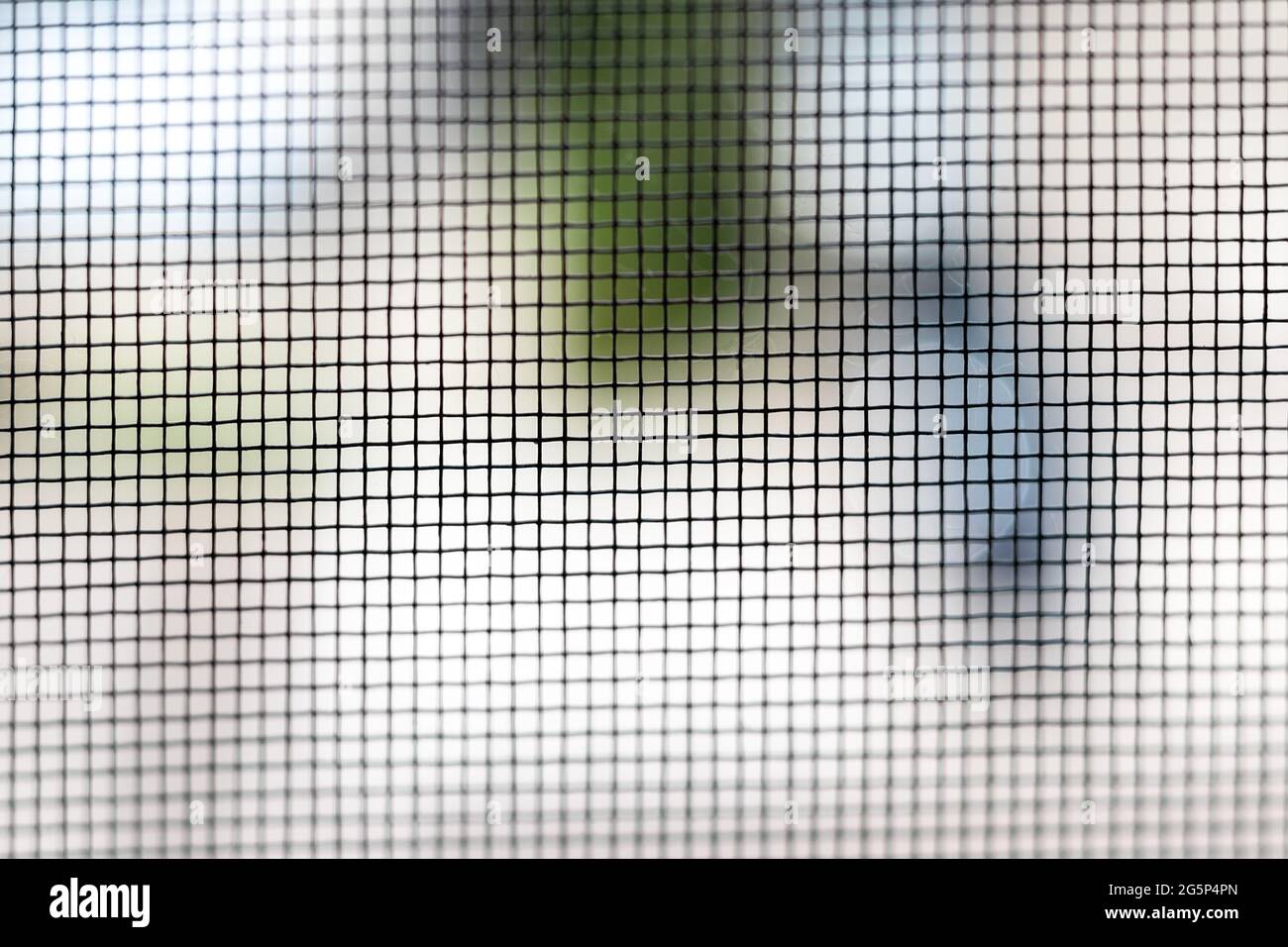 Mosquito net on the window closeup. Protection of the house from small ...