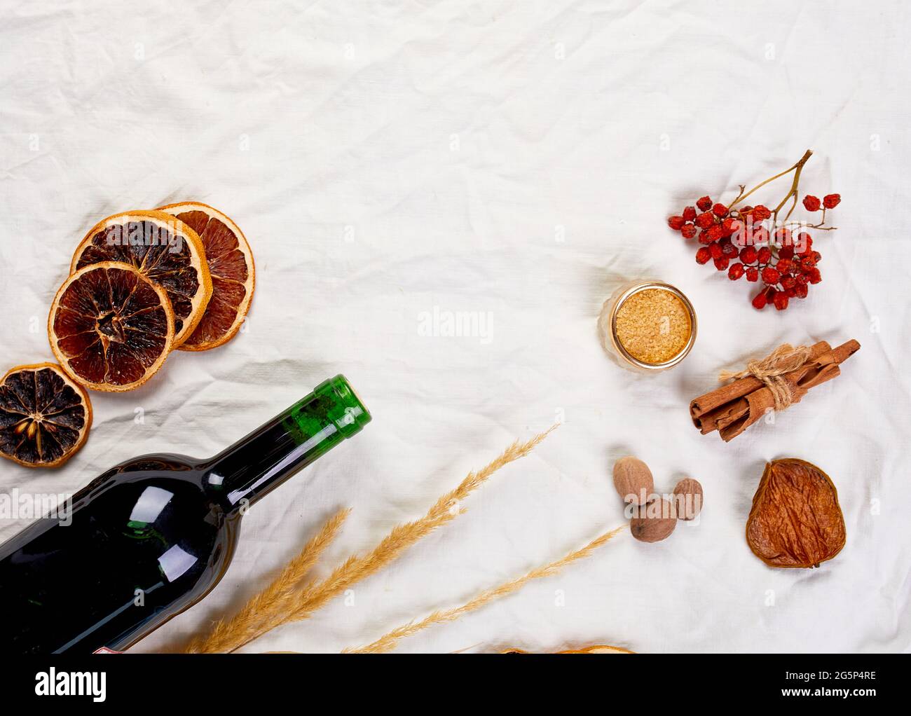 Flat lay of ingredients and bottle of red wine for winter seasonal ...