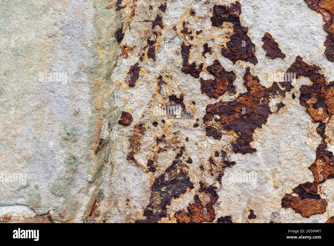 Gray stone wall with a splash of metal and rust background texture ...
