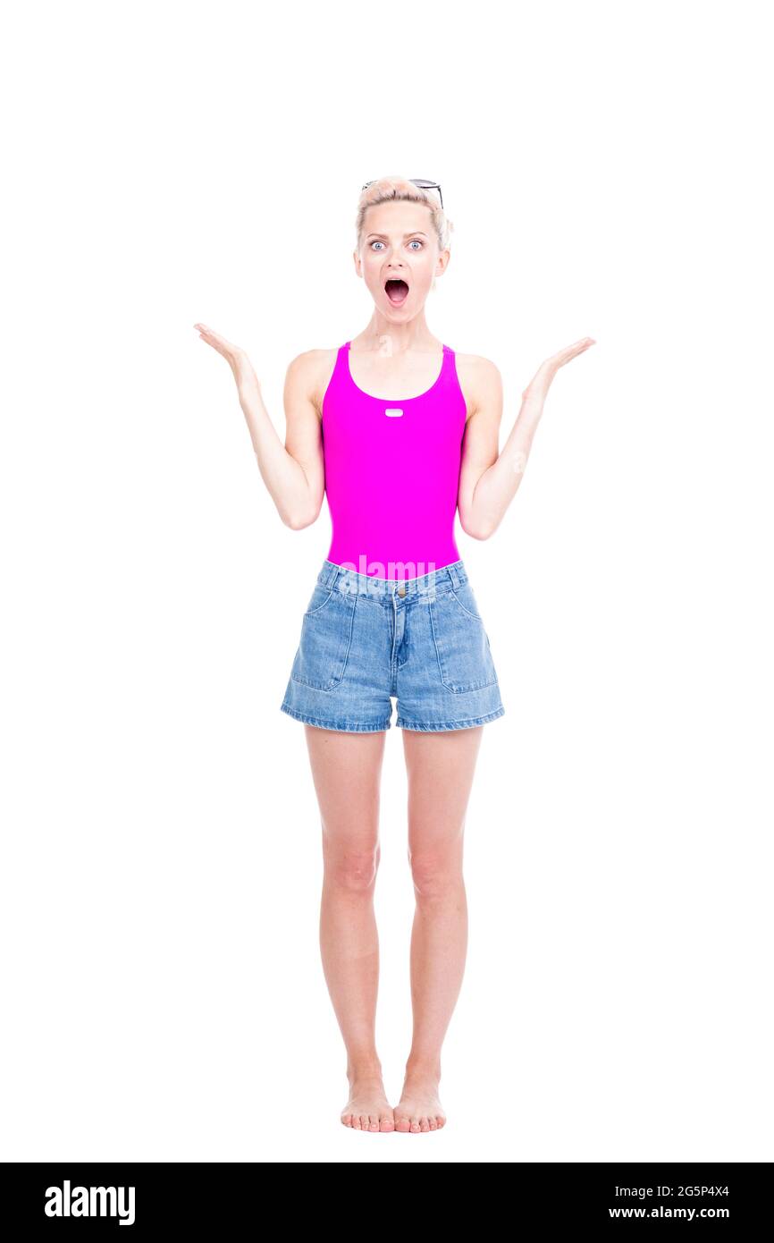 Vertical full length studio portrait of young Caucasian woman wearing ...