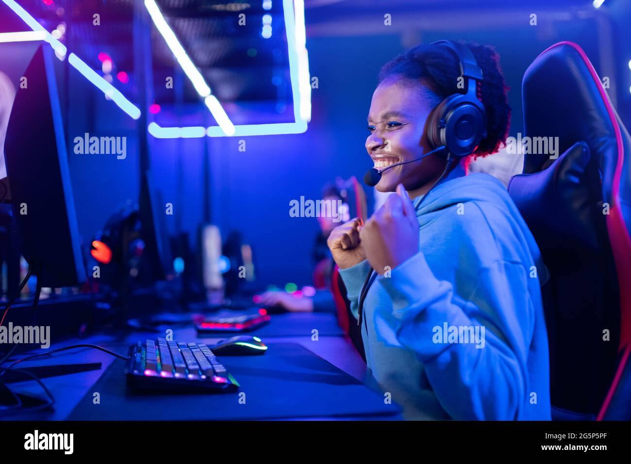 Young American African smile woman professional gamer win in online ...