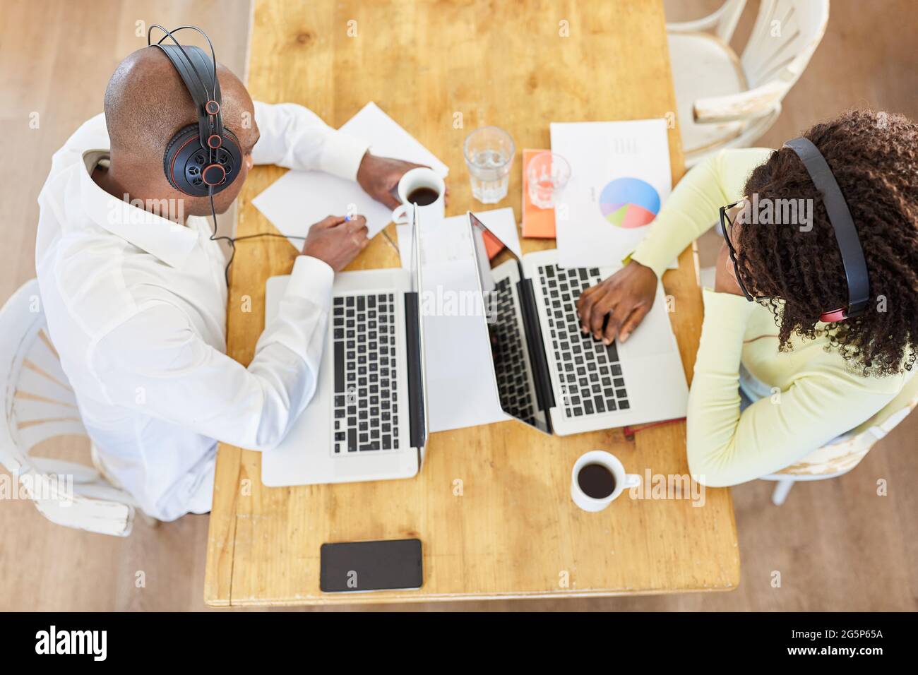 Business people working together on laptop computer online in the home ...