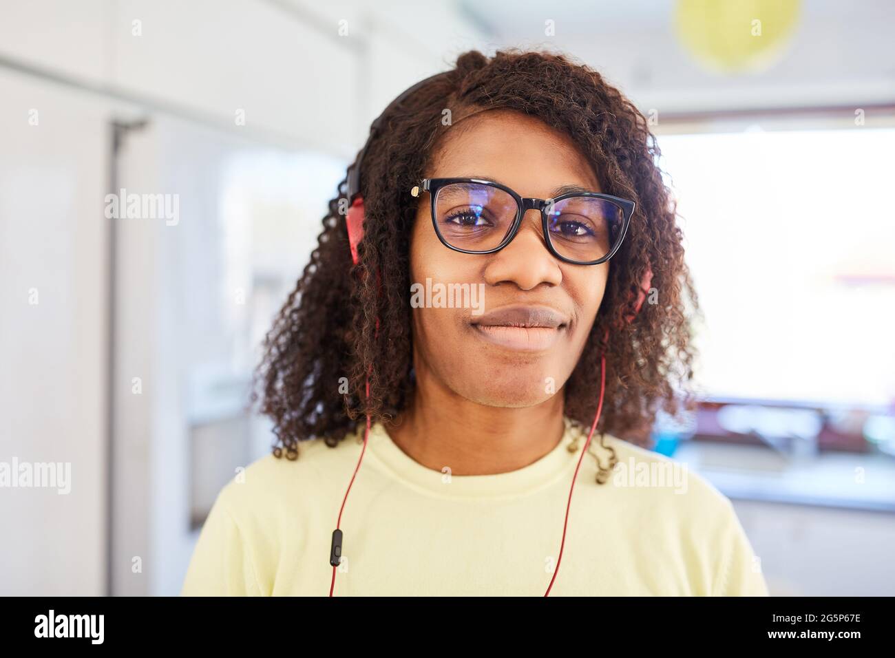 African American student with headphones during e-learning for further ... African American student with headphones during e-learning for further ...