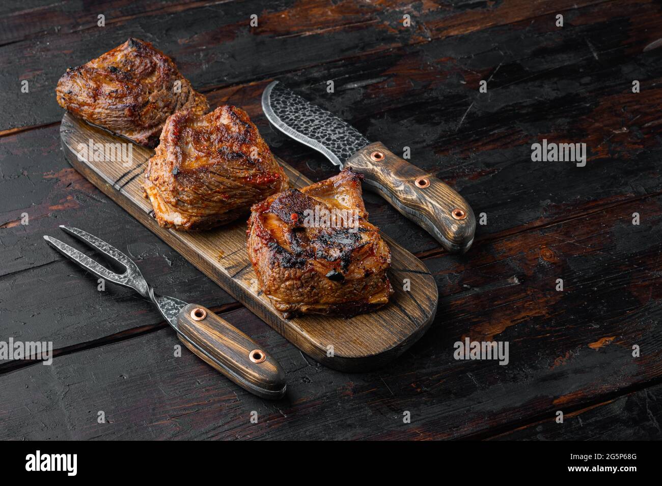 Homemade Braised Beef Short Ribs set, on old dark wooden table ...