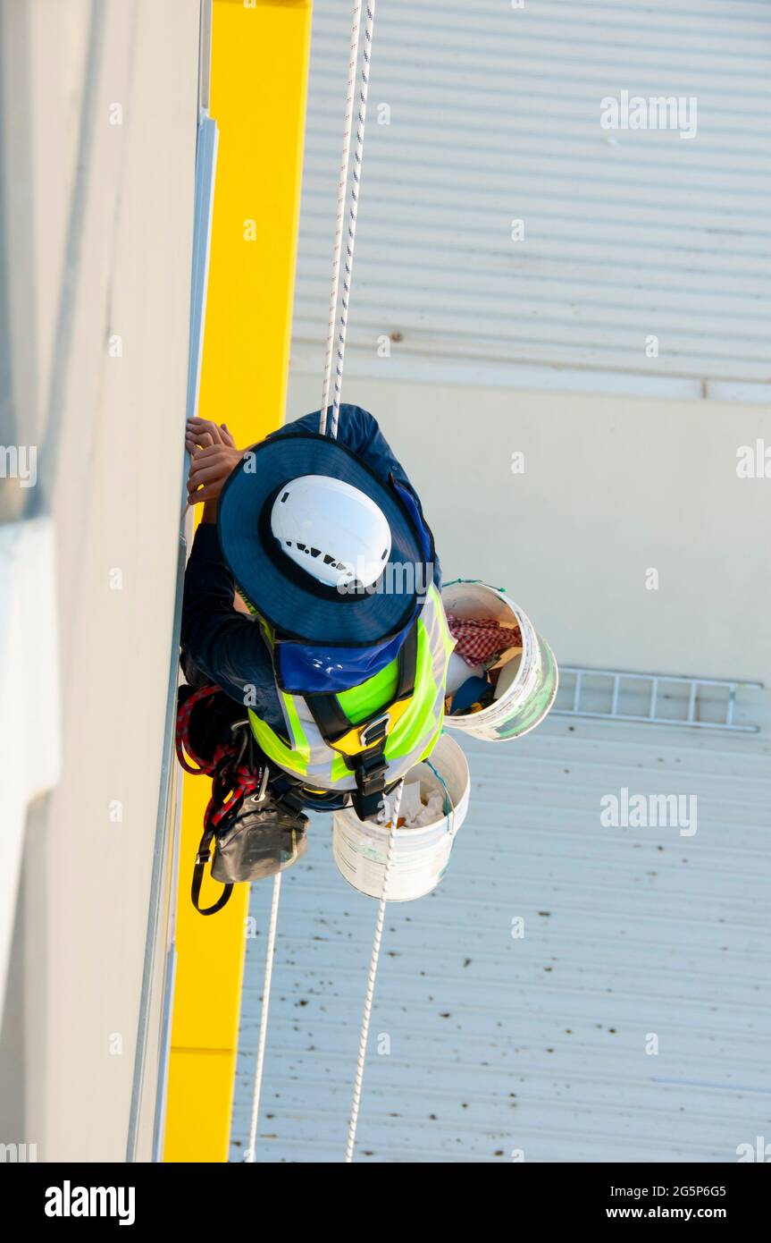 Maintenance Work by an Abseiling Technician Stock Photo - Alamy