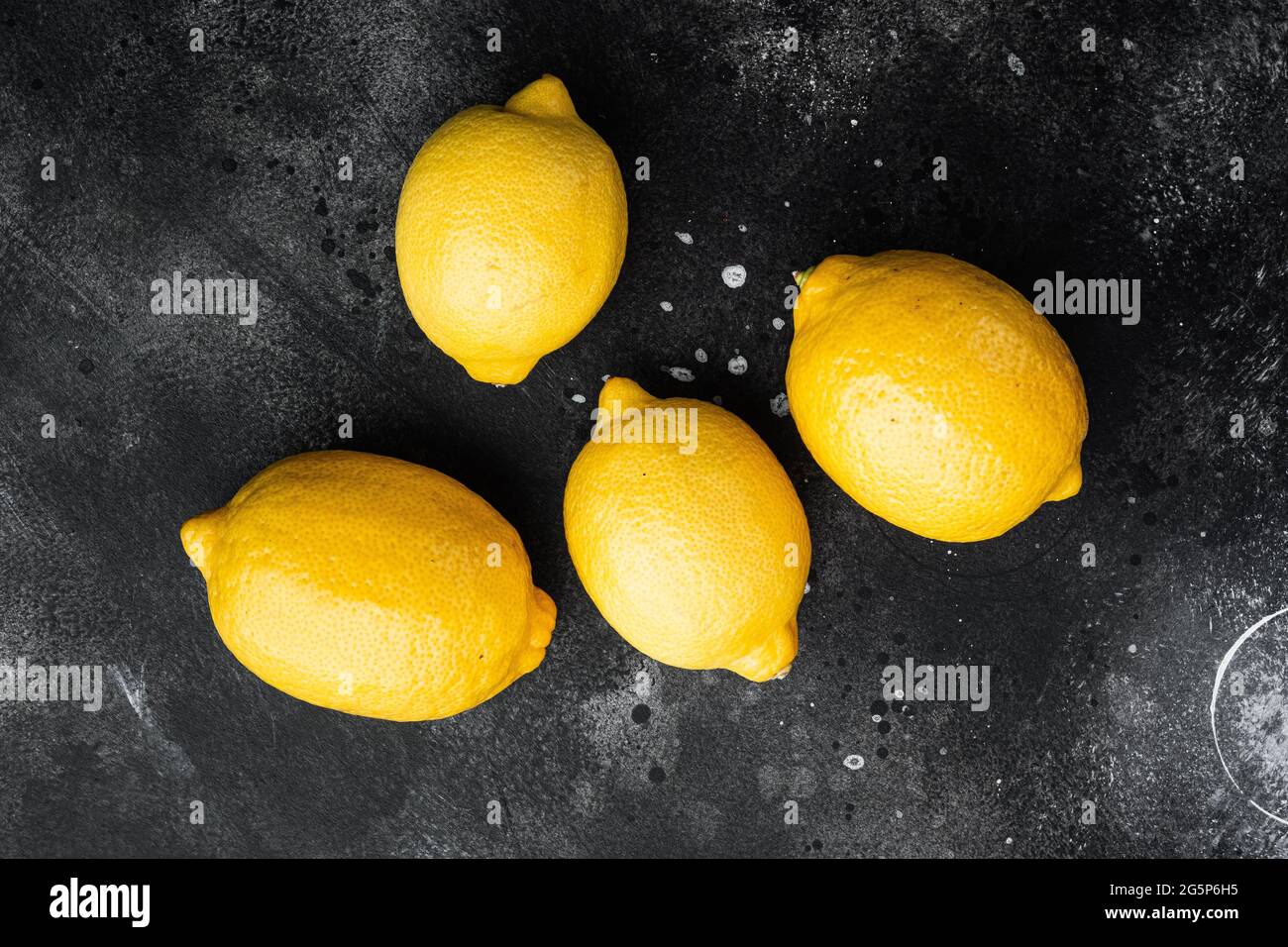 Whole ripe lemon set, on black dark stone table background Stock Photo ...
