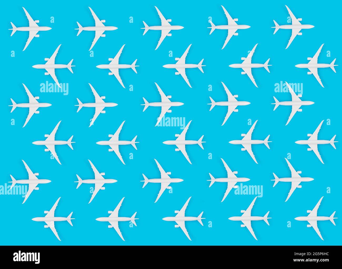 Bright blue background with a pattern of white airplanes Stock Photo ...