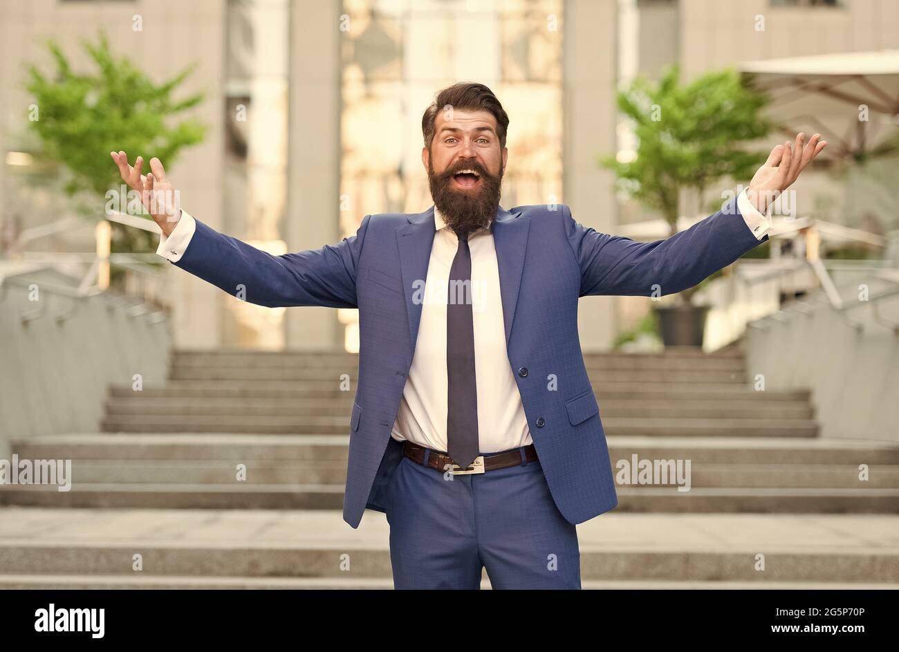 Dressed for success. Successful man celebrate victory outdoors ...