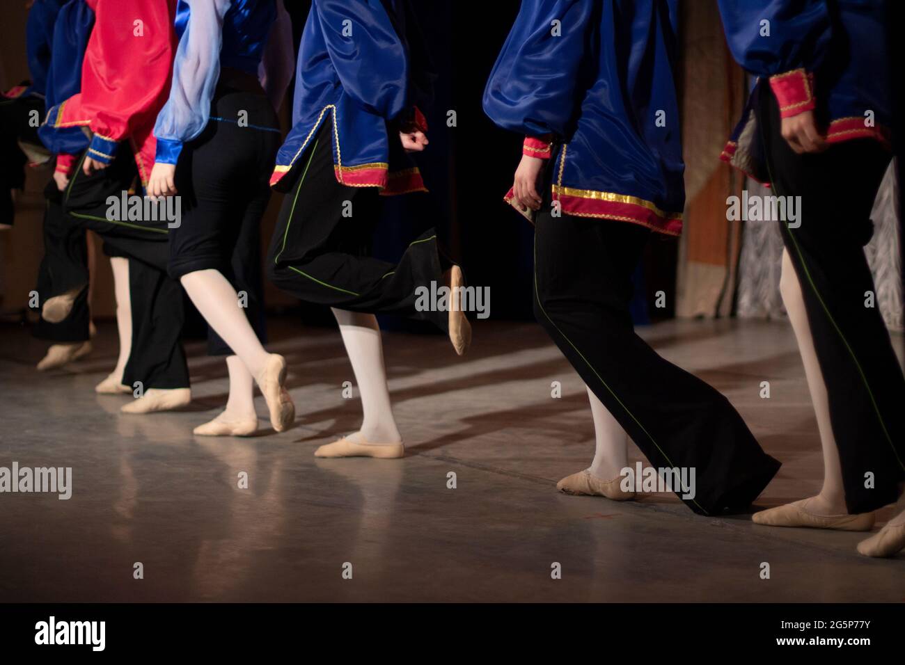 Children perform with dance on stage. Dance lessons. A lot of kids in ...