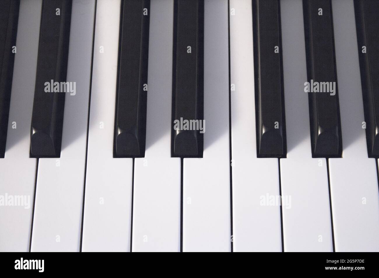 Part of the keyboard of a piano in white color. No people Stock Photo ...