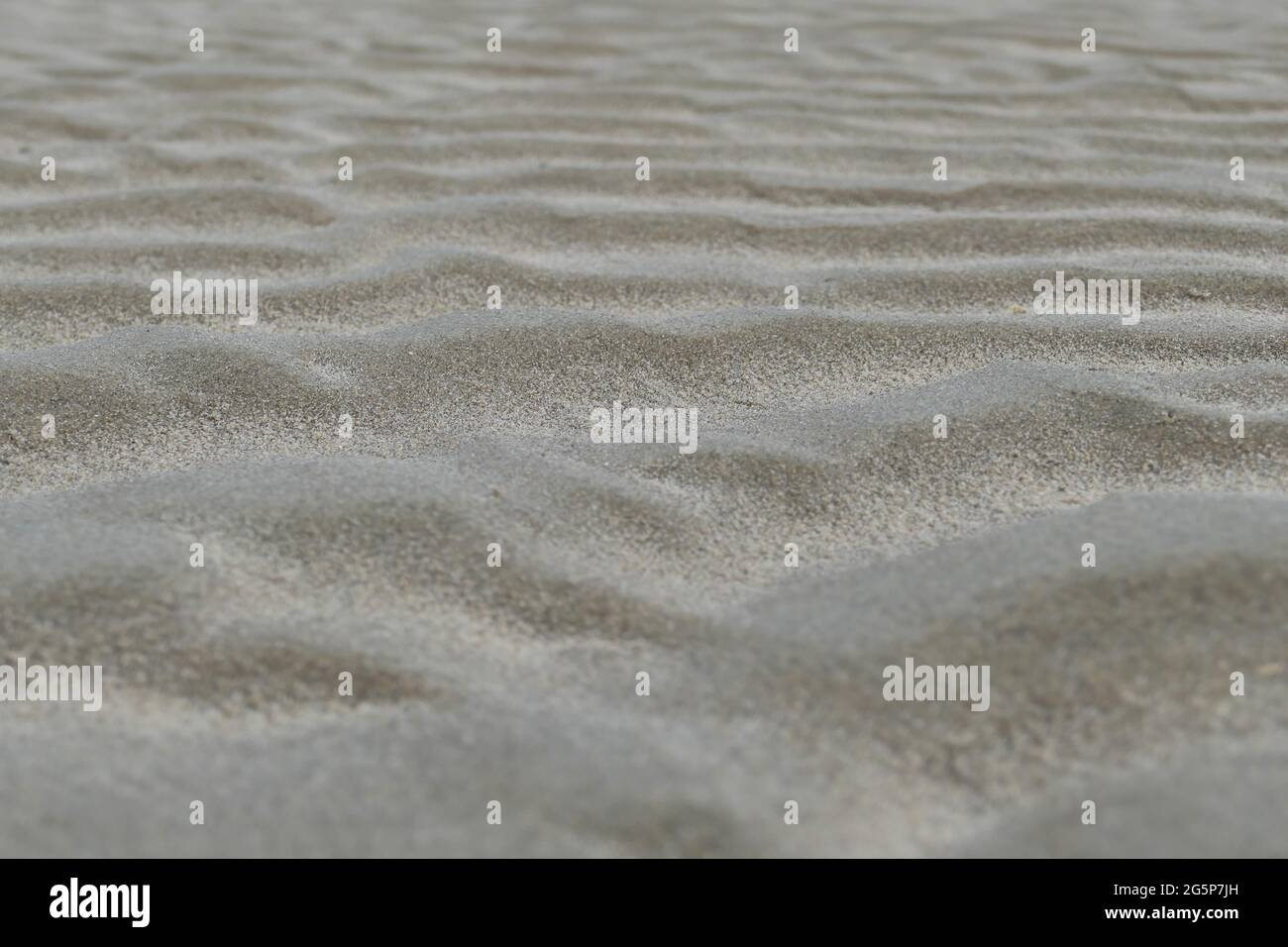Ripples in the sand on the beach caused by waves and tides Stock Photo ...