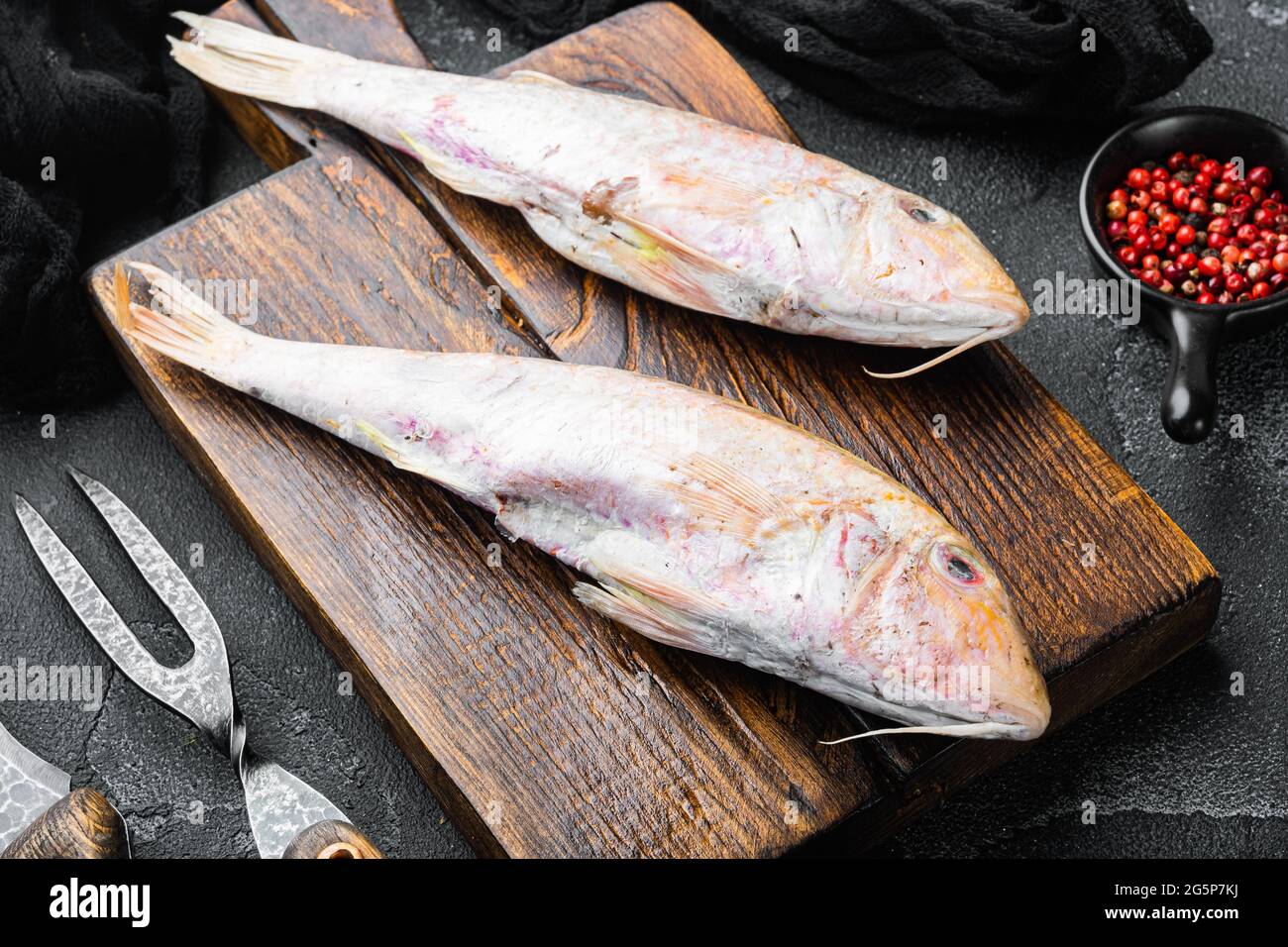 Raw fresh mullet or barabulka whole fish set, with ingredients and ...