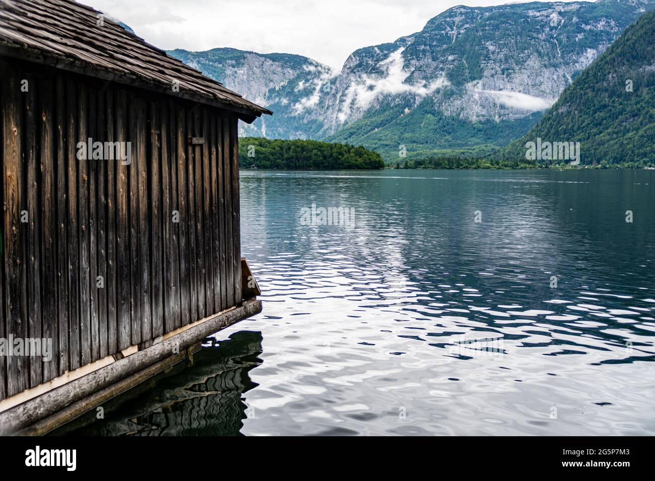 Traditional wooden boathouses in Hallstatt in Austria. Hallstatt is a ...