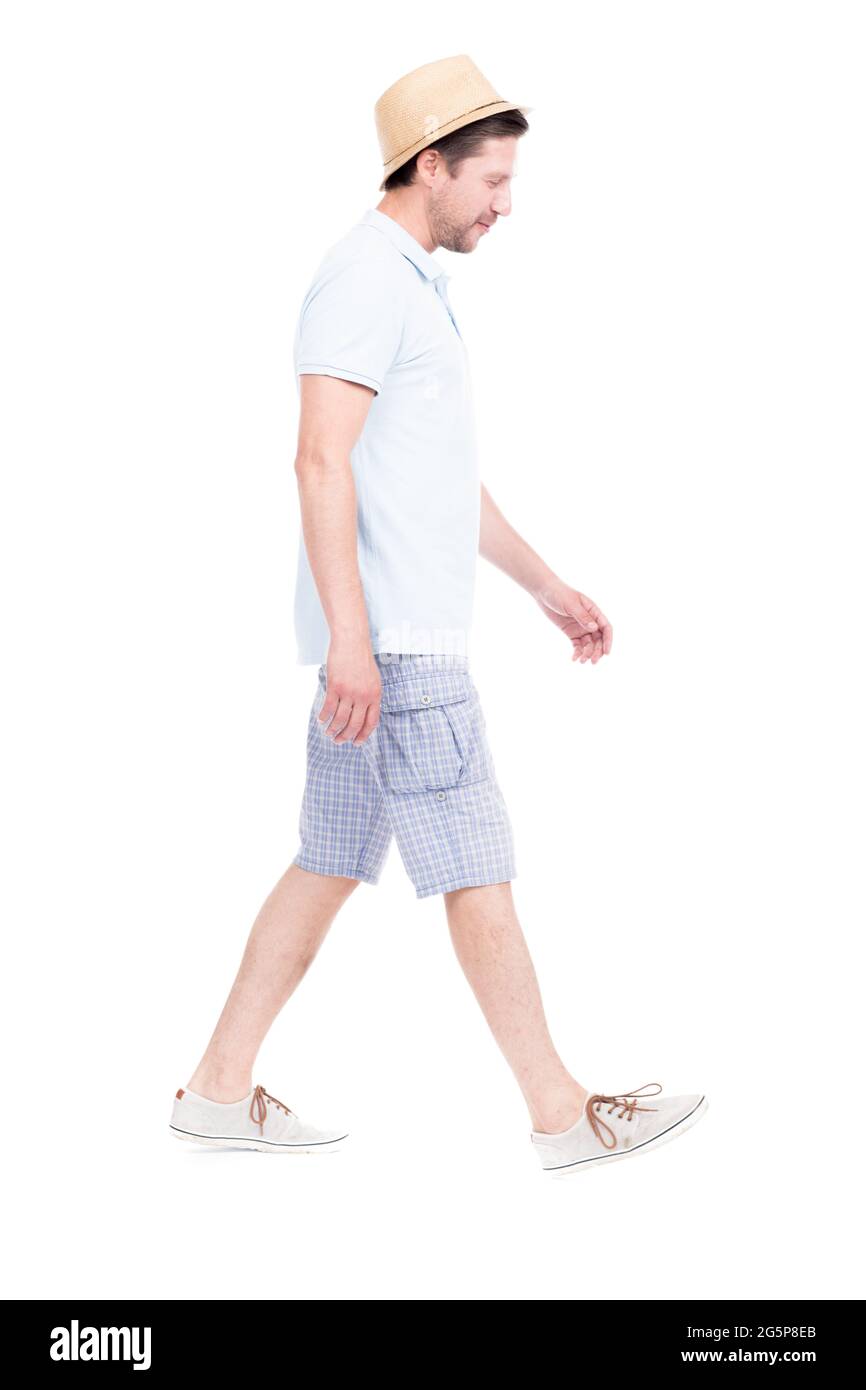 Vertical full length side view portrait of handsome bearded Caucasian ...