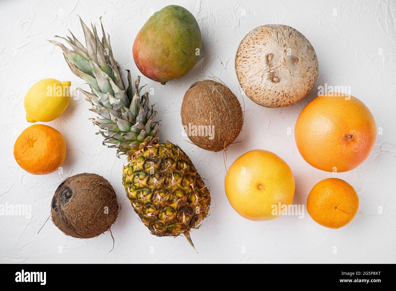 Assortment of different fruits set, on white stone table background ...