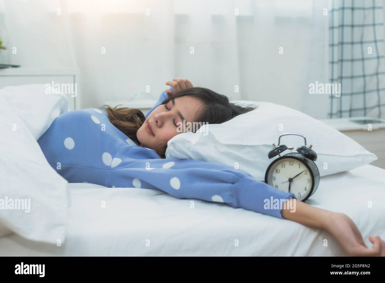 beautiful woman sleep on bed and get up late Stock Photo - Alamy
