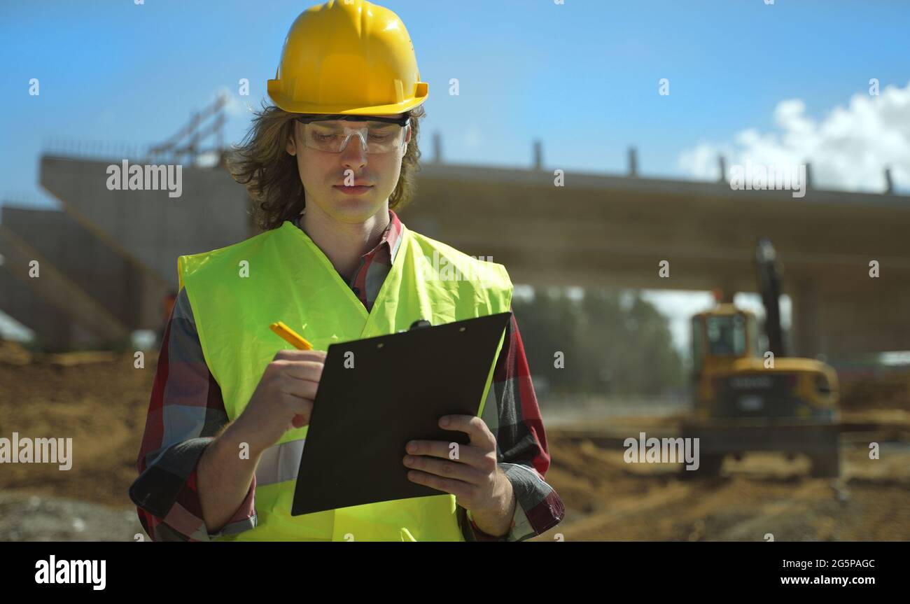 Construction supervisor checking documents hi-res stock photography and ...