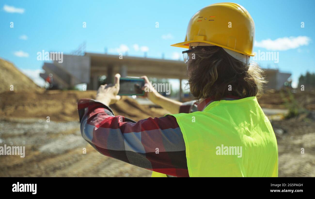 Building contractor with mobile phone shooting work they done Stock ...