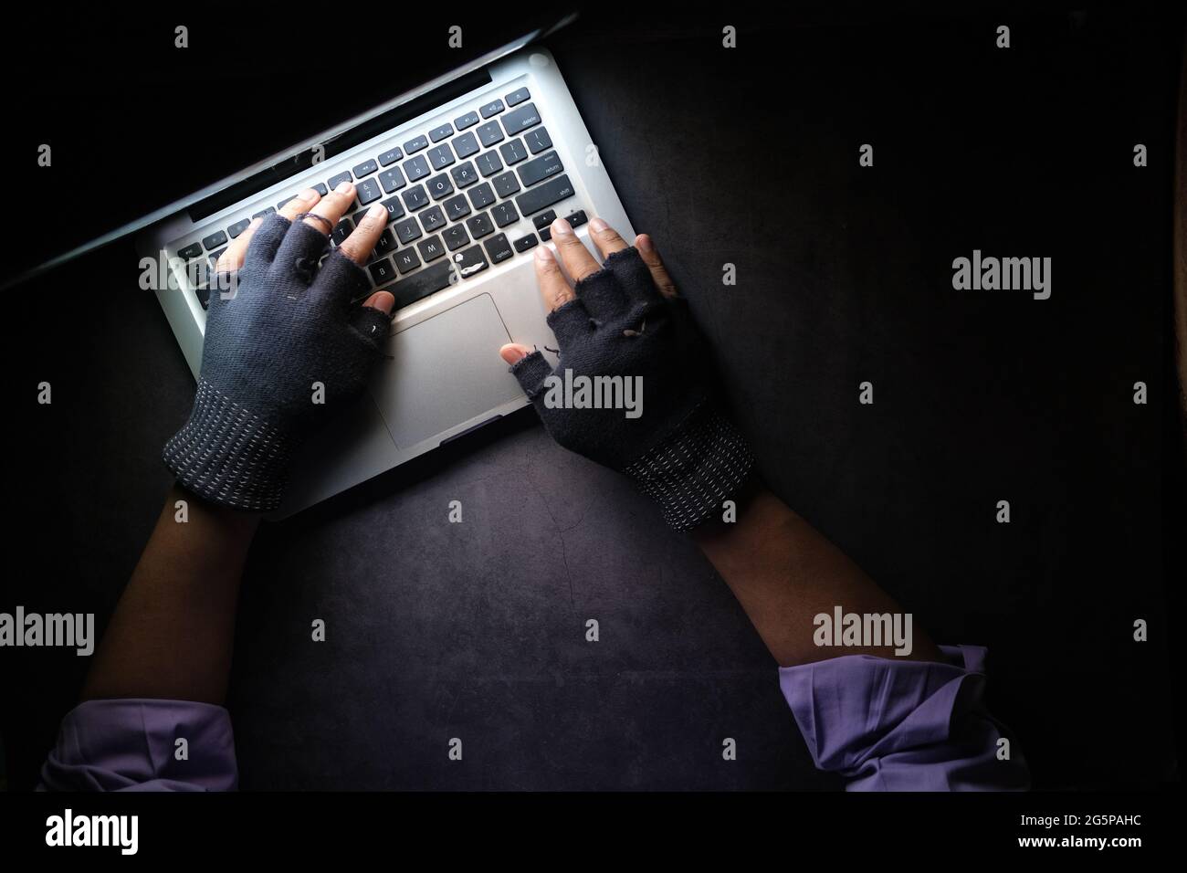 hacker hand stealing data from laptop top down Stock Photo - Alamy