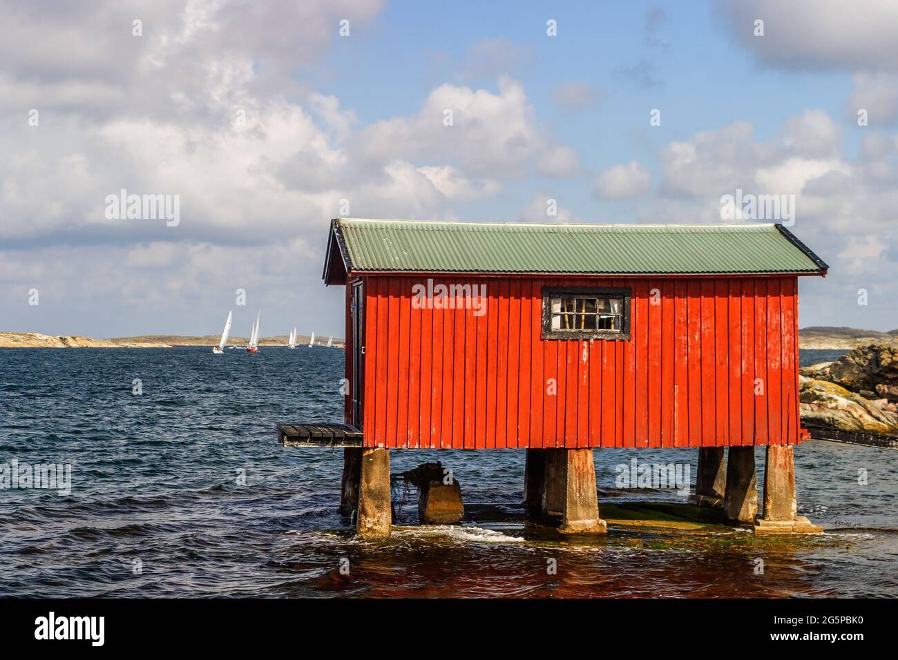Red boathouse by the sea Stock Photo - Alamy