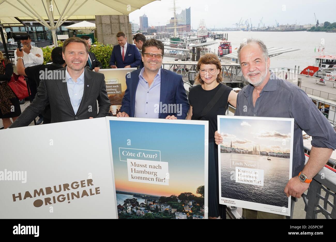 29 June 2021, Hamburg: Actor Marek Erhardt (r-l), Julia Bode, owner of ...