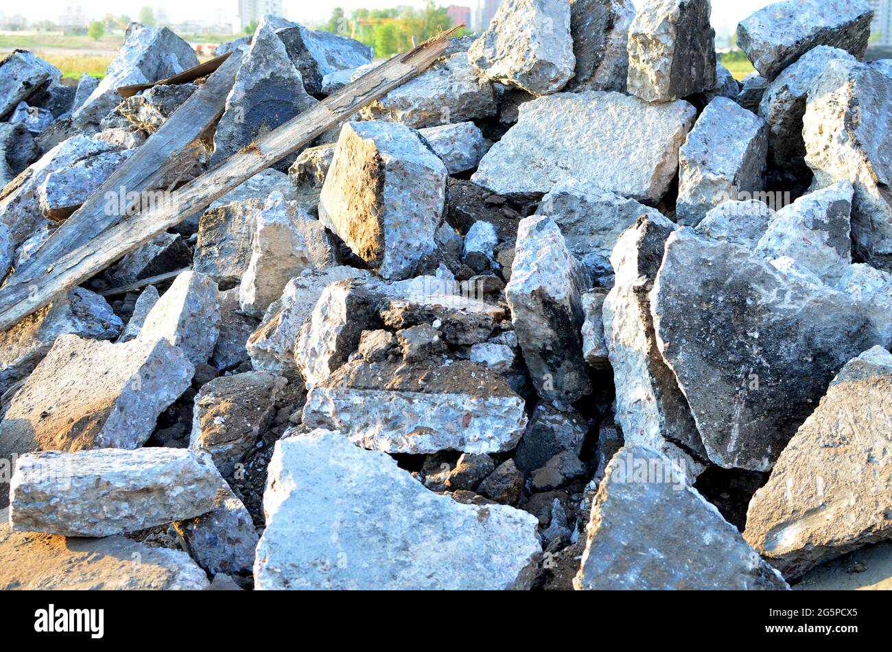 Broken pieces of asphalt at a construction site. Recycling and reuse ...