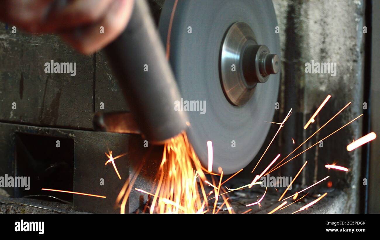 Closed Up Grinding Stone With Sparks Stock Photo - Alamy