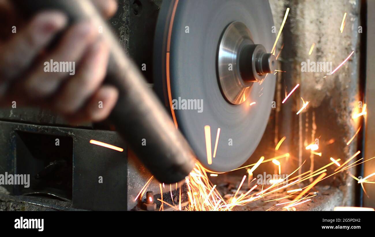 Closed Up Grinding Stone With Sparks Stock Photo - Alamy
