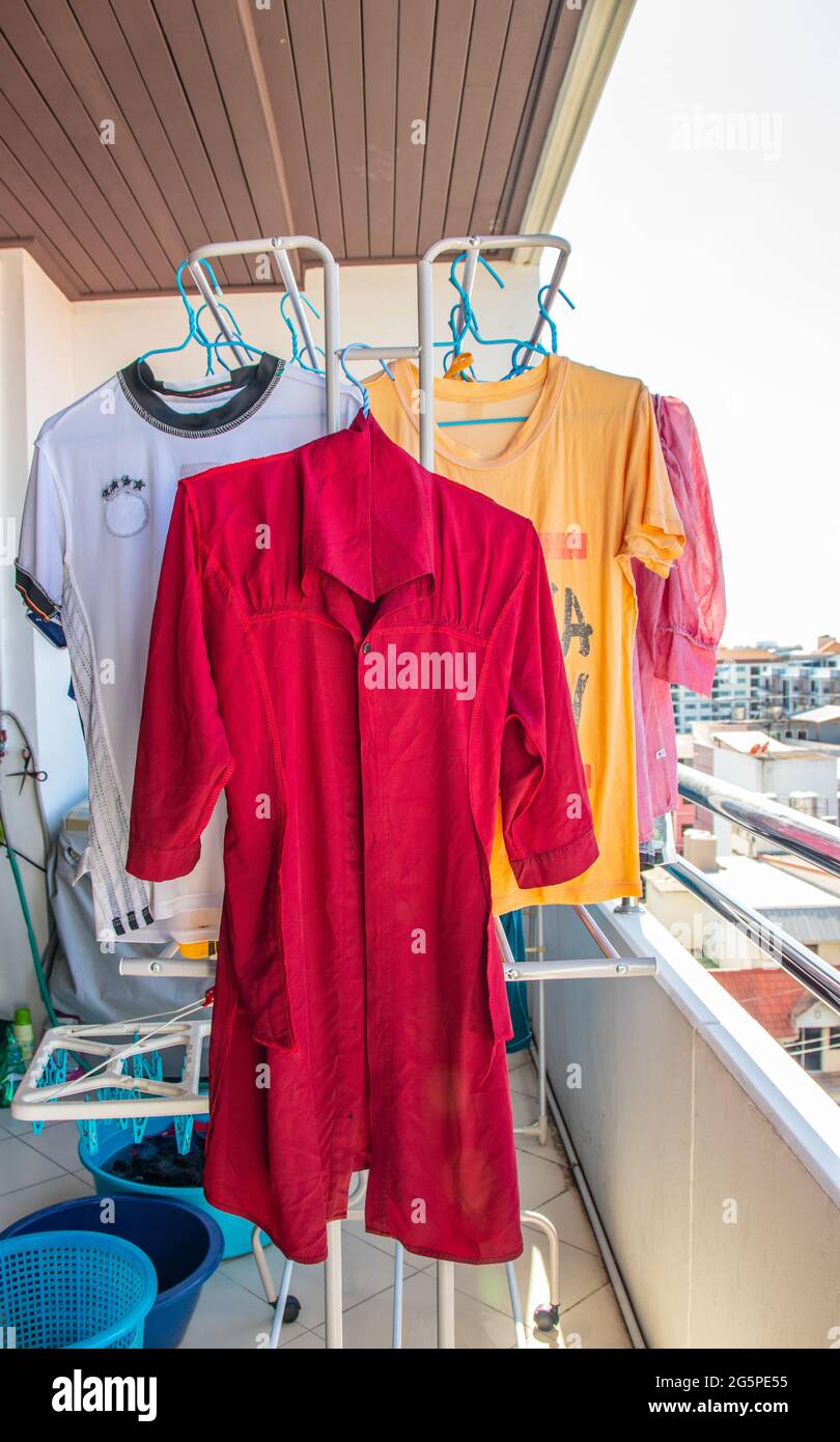 wwet laundry is hung up to dry on the balcony Stock Photo - Alamy