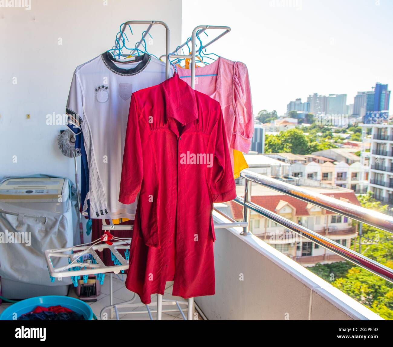 wwet laundry is hung up to dry on the balcony Stock Photo - Alamy