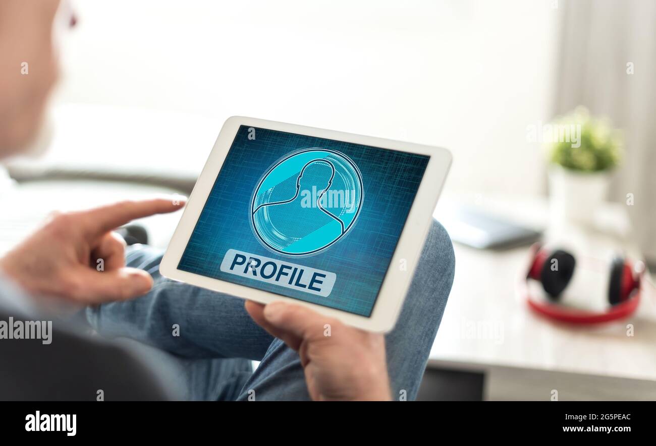 Tablet screen displaying a profile concept Stock Photo - Alamy