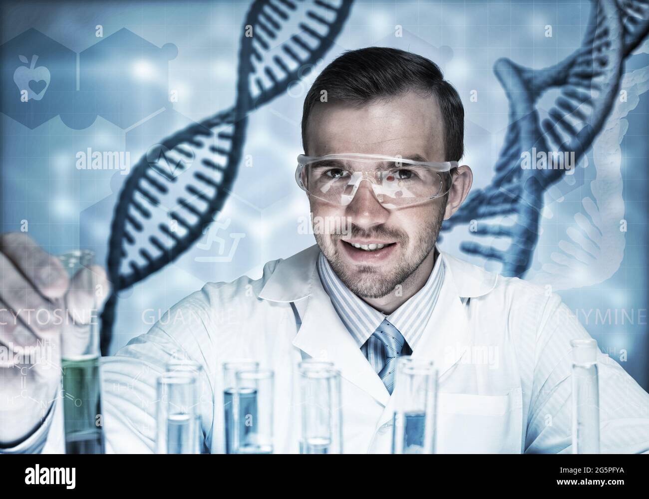 Young scientist mixing reagents in glass flask in clinical laboratory ...